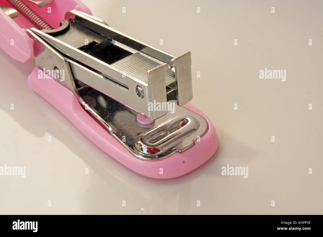 Pink stapler tool. Pink office tool Stock Photo - Alamy