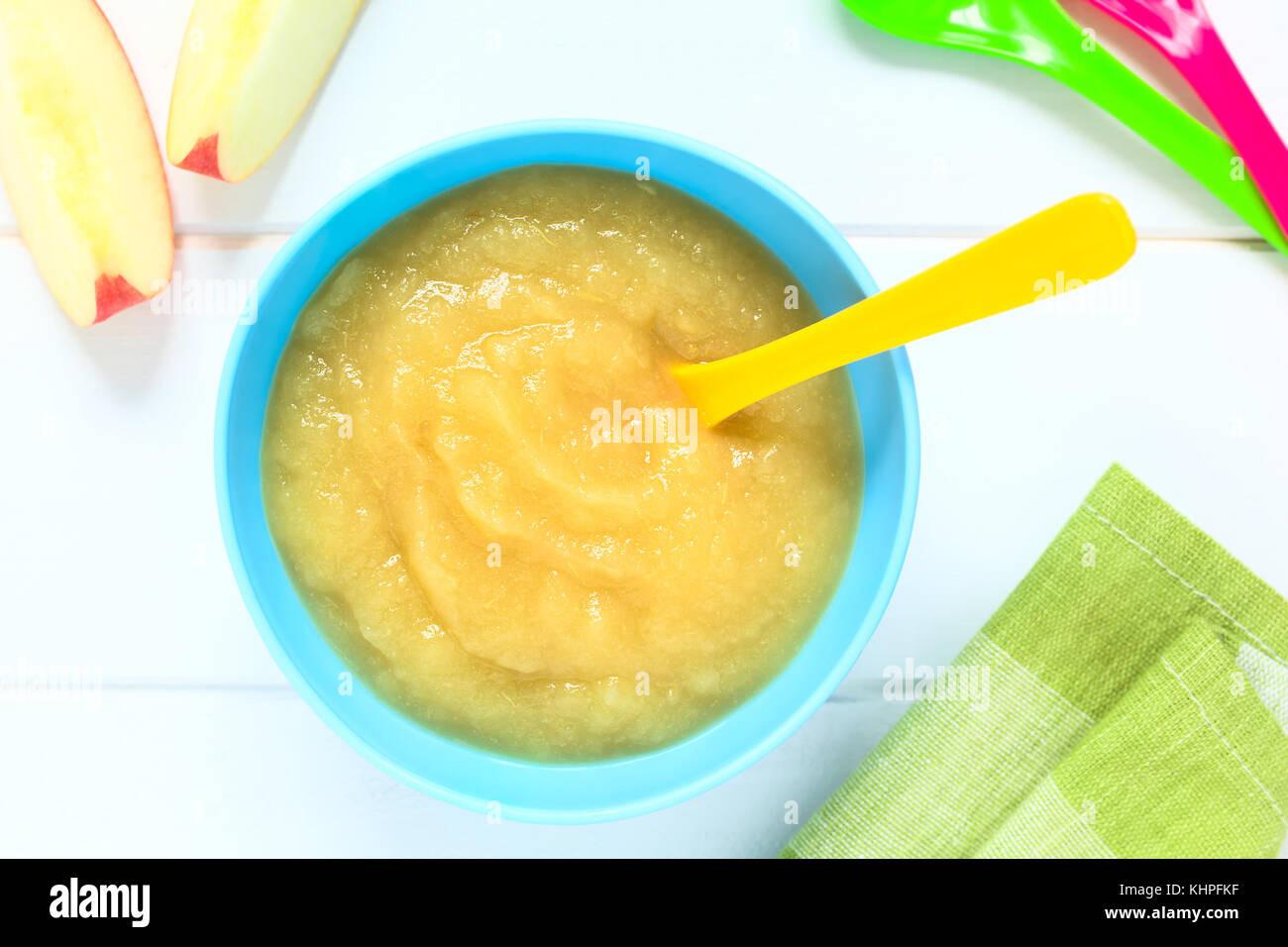 Fresh homemade apple sauce in bowl with colorful spoons, photographed ...