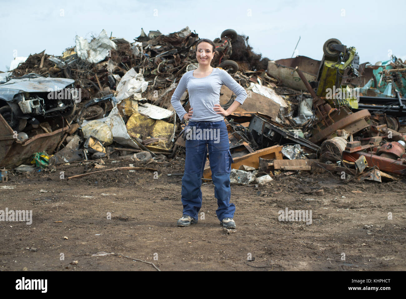 female worker posing at a scrap yard Stock Photo - Alamy