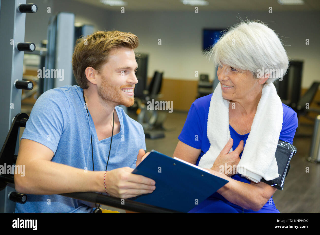 senior woman doing sport exercises with coach or personal trainer Stock ...