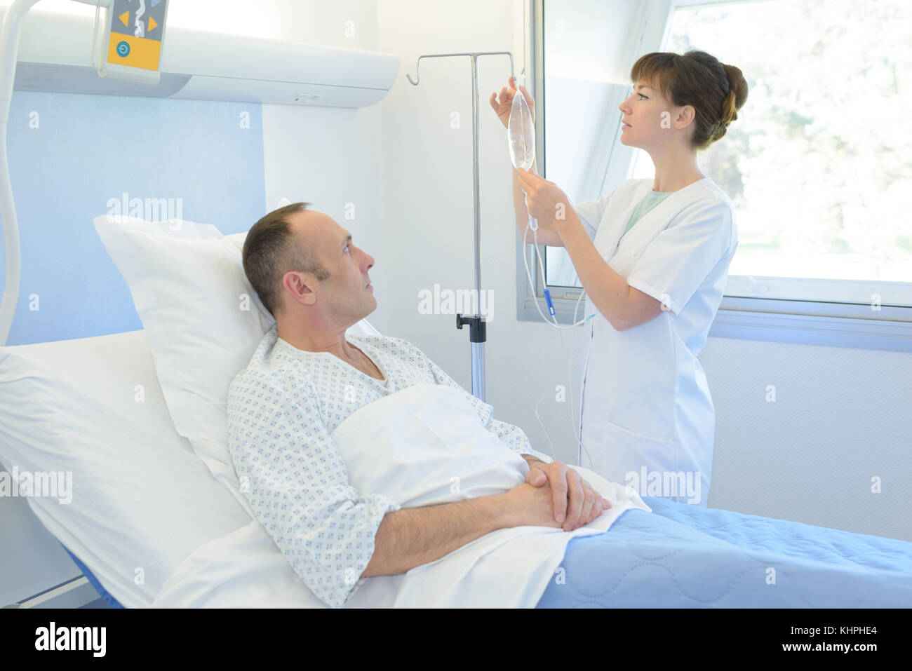 nurse giving an injection to a patient at the hospital Stock Photo - Alamy