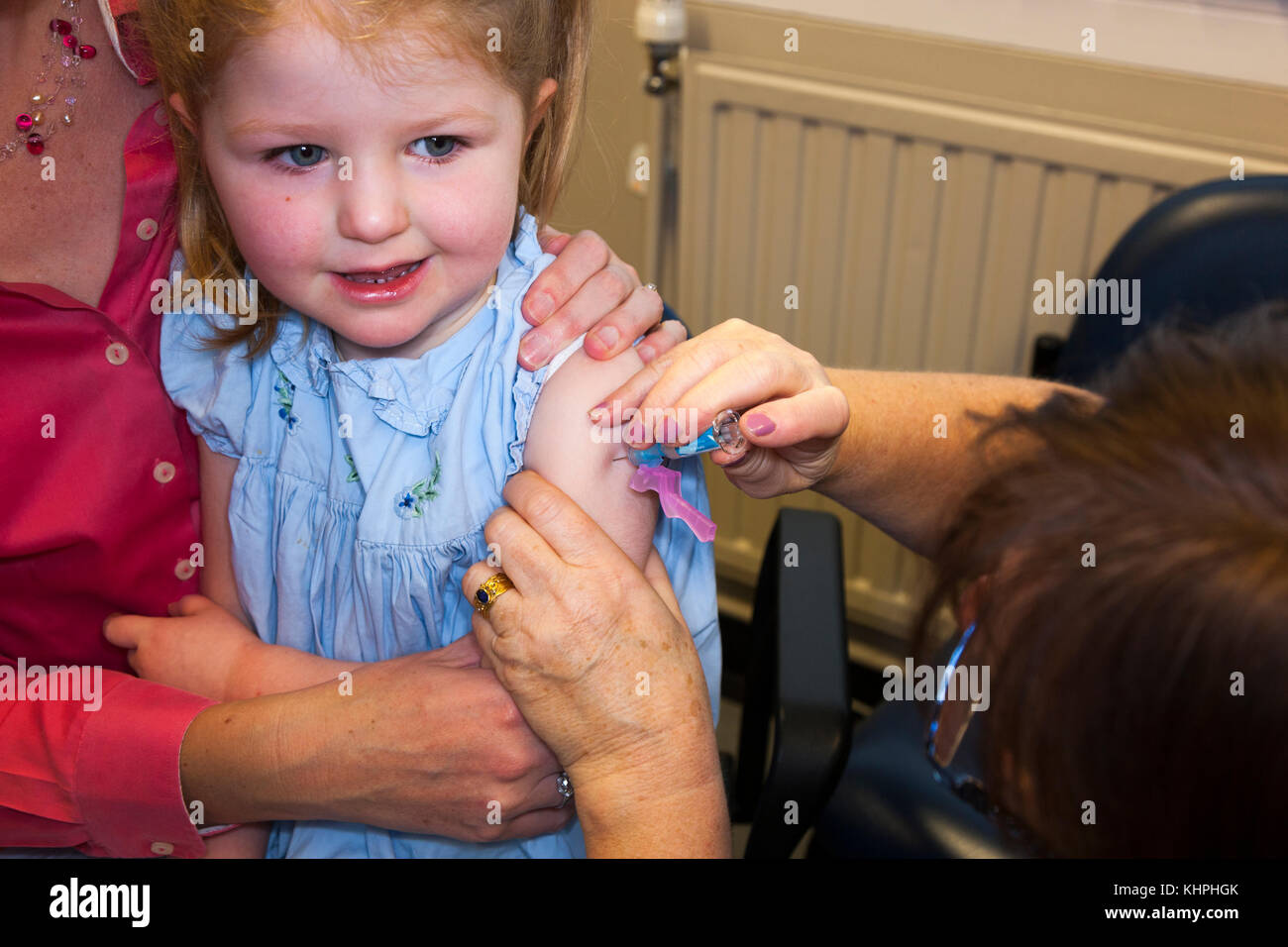 Practice nurse giving NHS 4-in-1 pre-school booster / Pre school ...