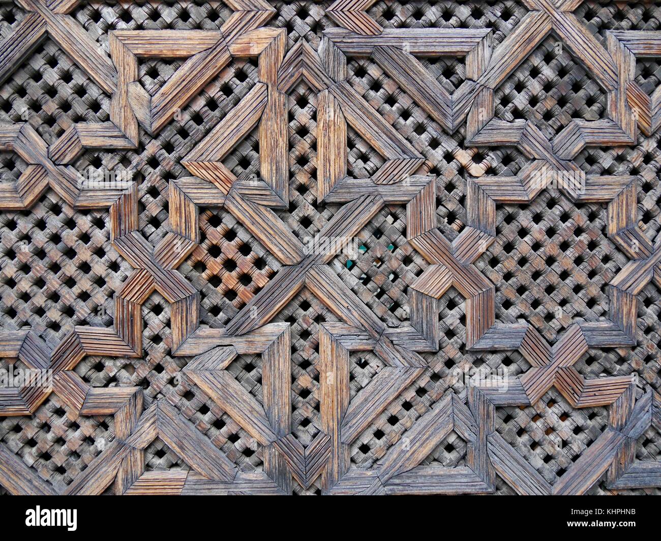 Close up of part of wooden panel in mosque with traditional pattern ...