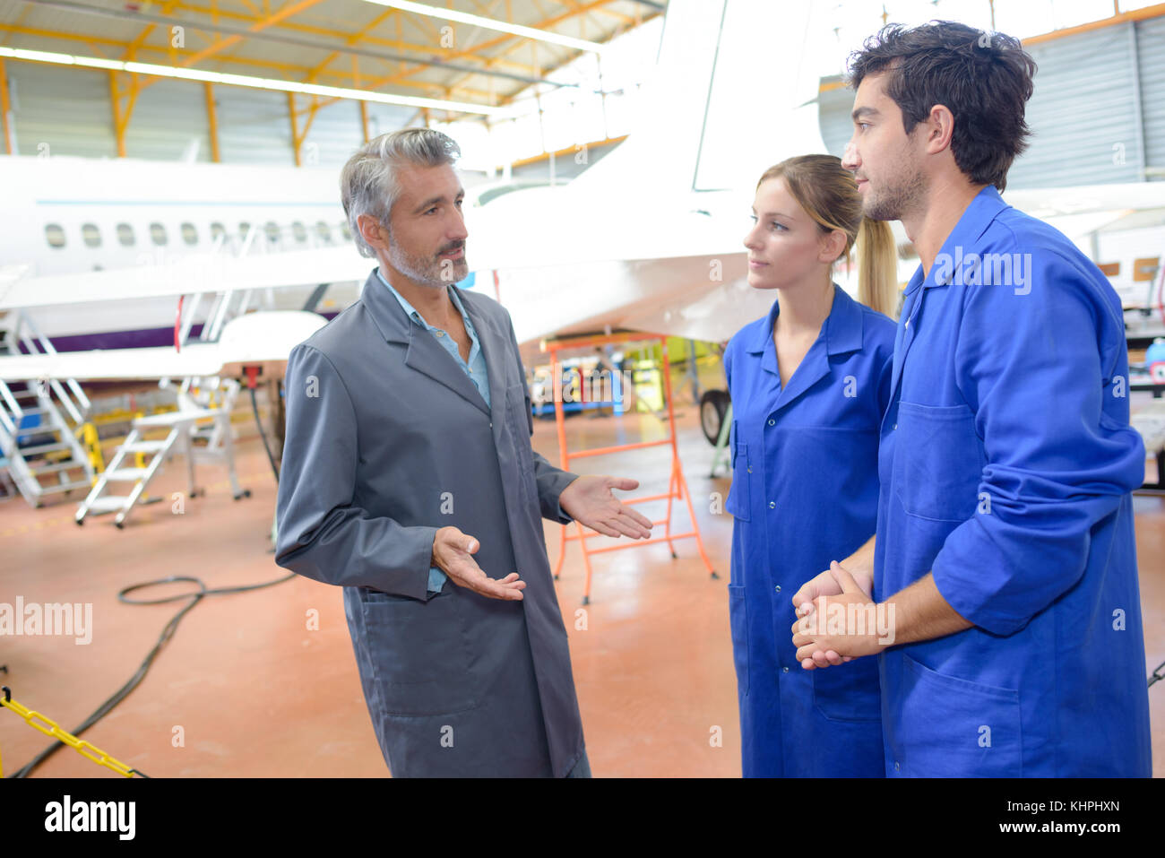 airport workers handling airplane Stock Photo - Alamy