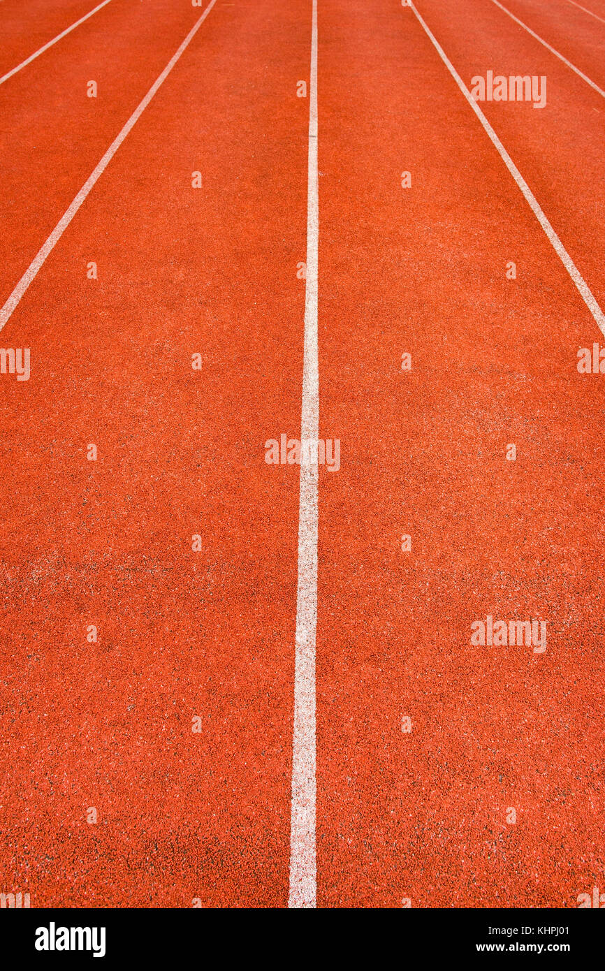 Red running Track in the stadium in Thailand Stock Photo - Alamy