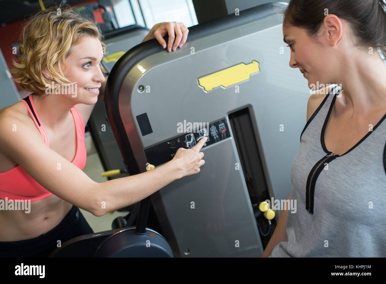women using machines in the gym Stock Photo - Alamy