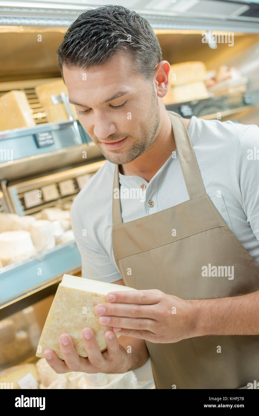 Man holding piece cheese hi-res stock photography and images - Alamy