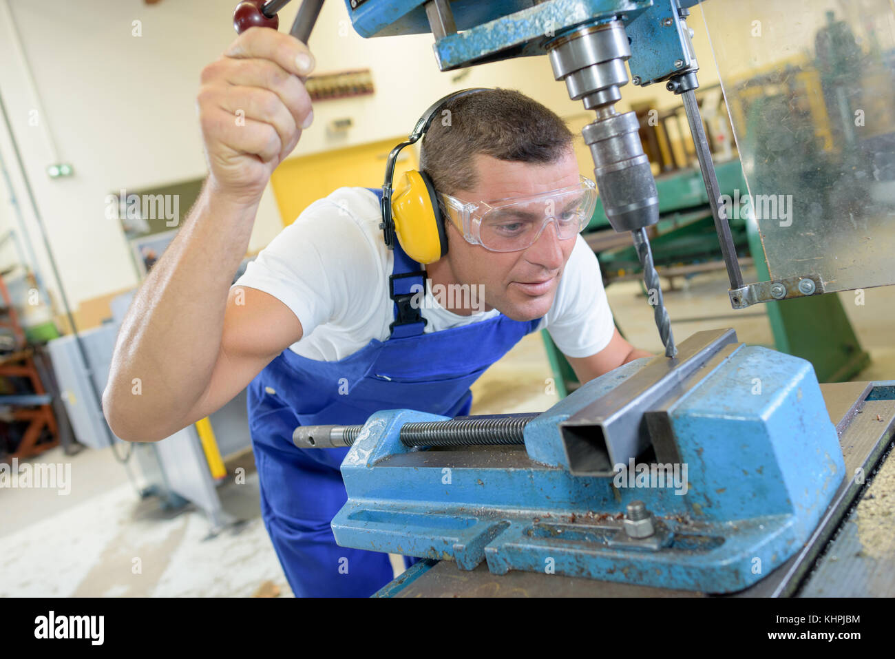 Engineer using bench drill Stock Photo - Alamy