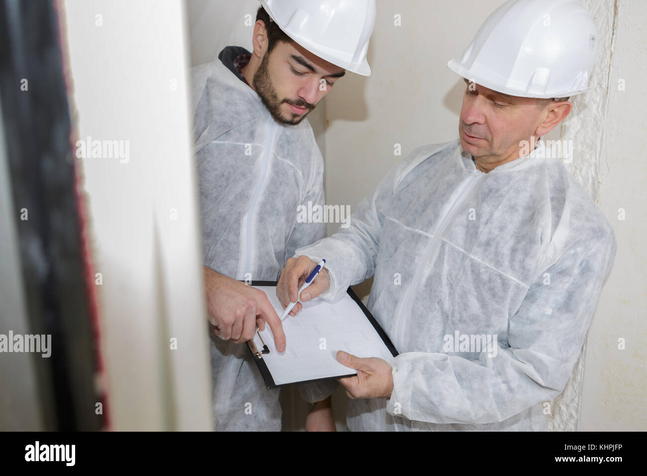 Documents two construction workers hi-res stock photography and images ...