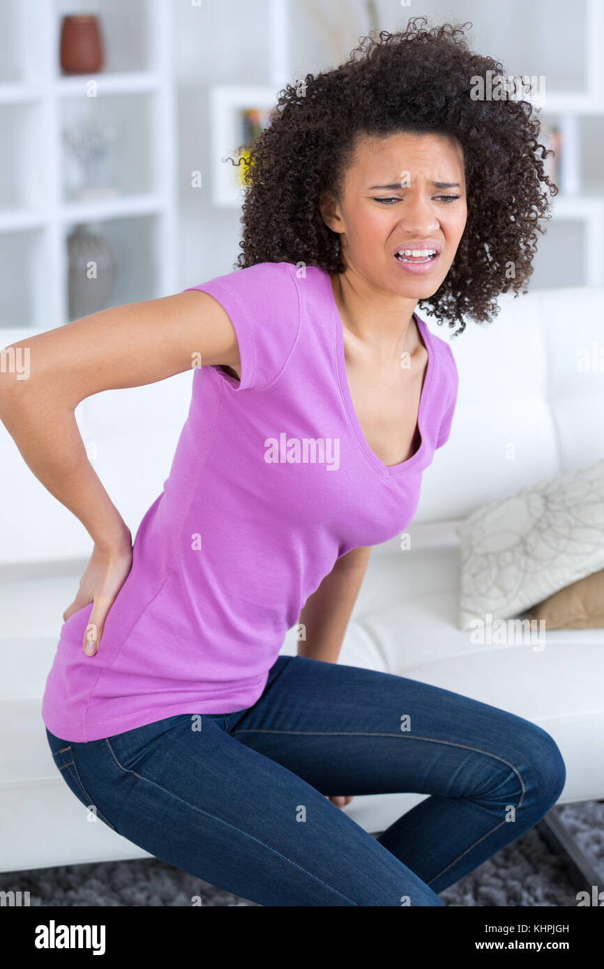 woman with severe lower back pain Stock Photo - Alamy