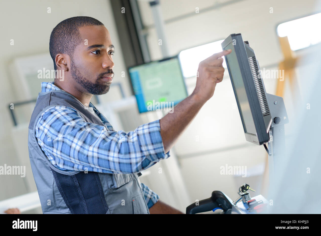 factory worker using computer Stock Photo - Alamy