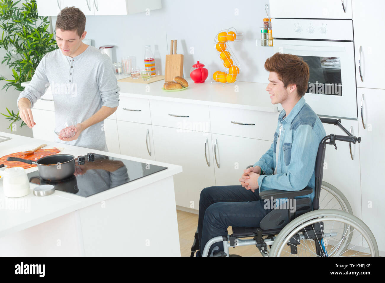 cooking for a disabled friend Stock Photo - Alamy