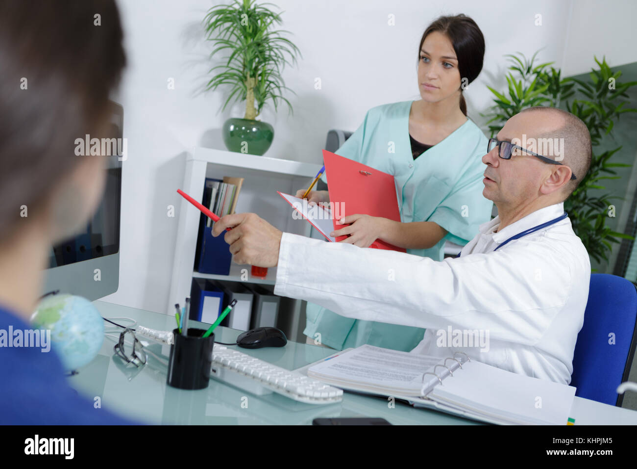 doctor talking to a patient nurse assistant aside Stock Photo - Alamy
