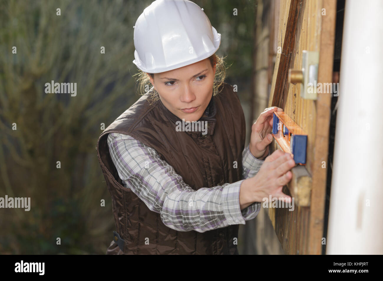 construction worker using building leve Stock Photo - Alamy