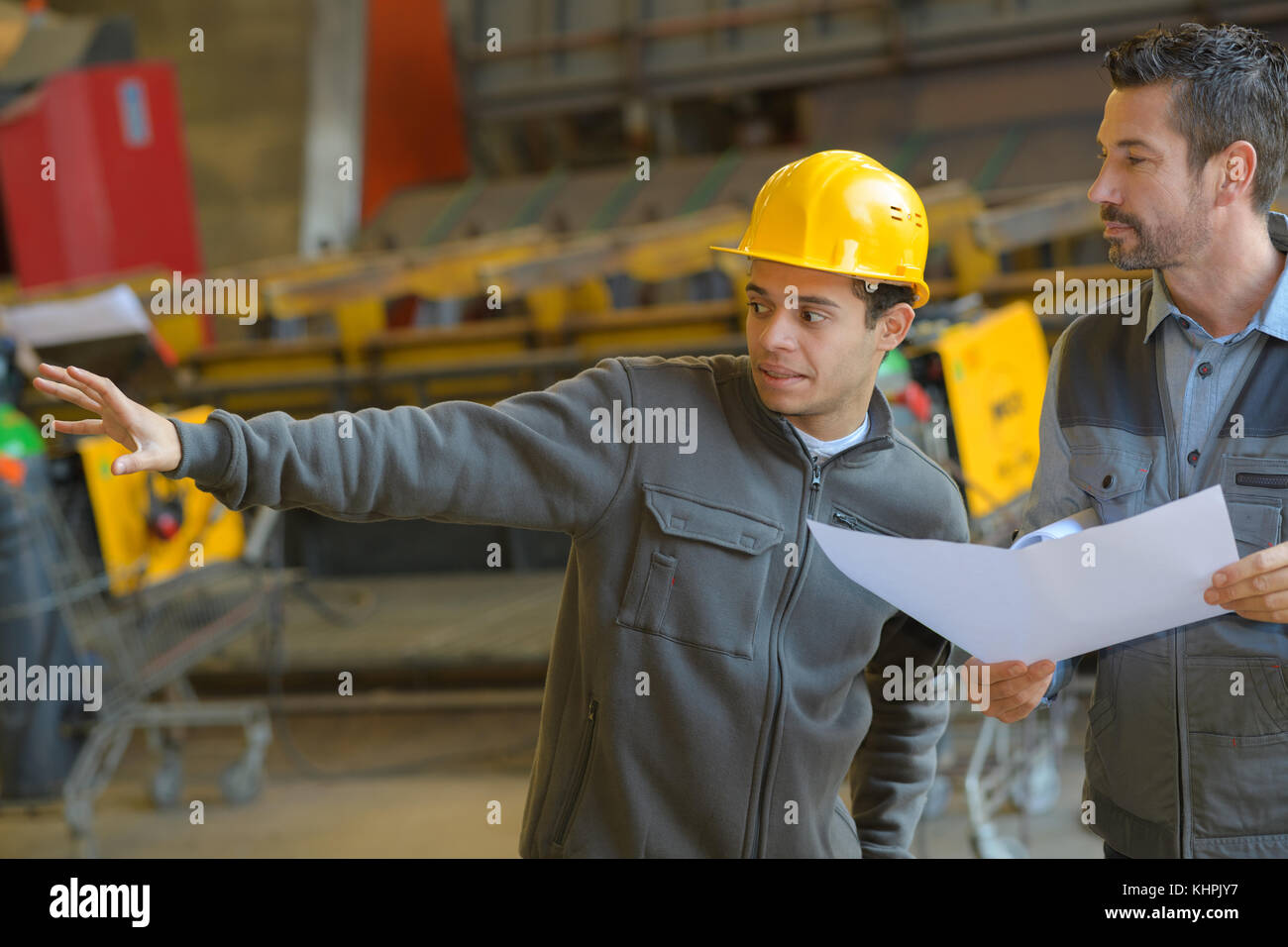 construction workers talking Stock Photo - Alamy
