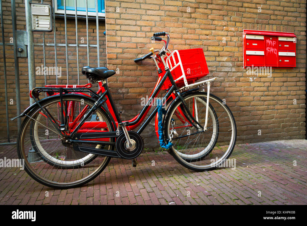 Traditional dutch bicycles parked on near brick wall in Amsterdam Stock ...