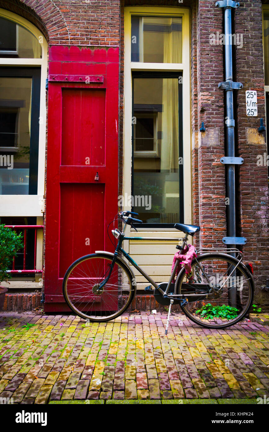 Traditional dutch bicycle parked at the front door in Amsterdam Stock ...