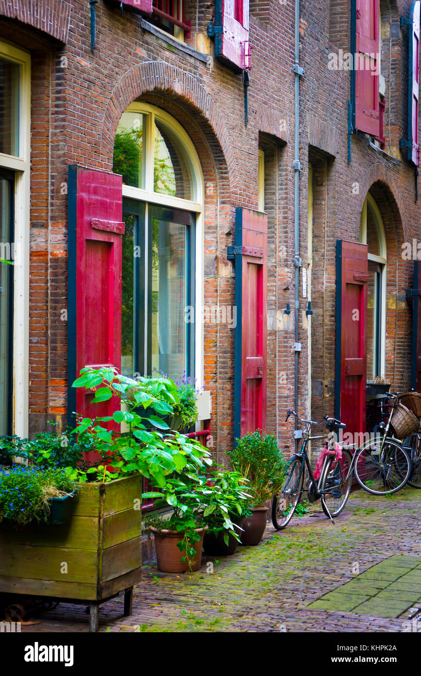 Traditional dutch bicycle parked at the front door in Amsterdam Stock ...