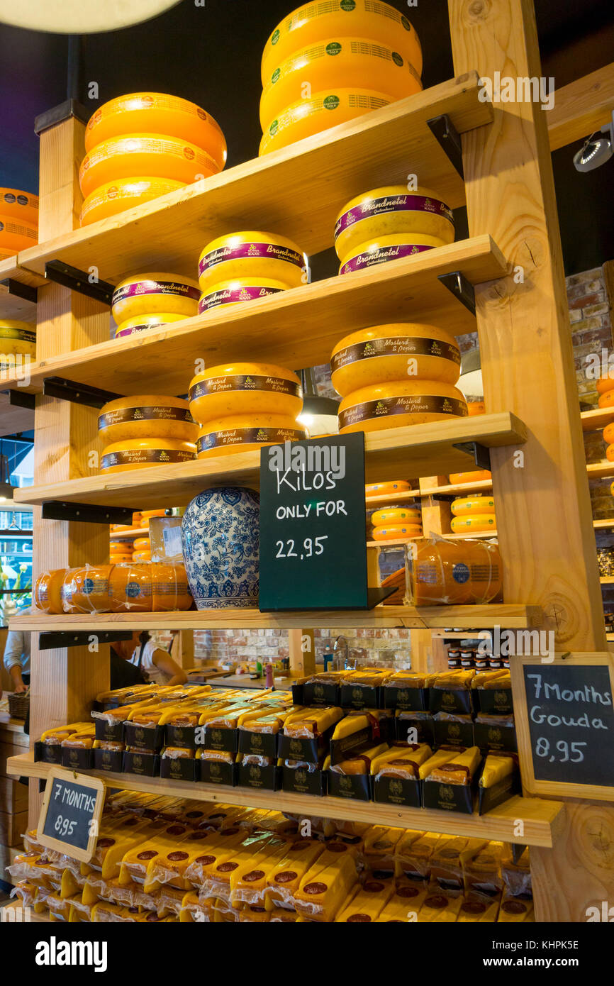 Cheese wheels are on the shelves in the store Stock Photo - Alamy