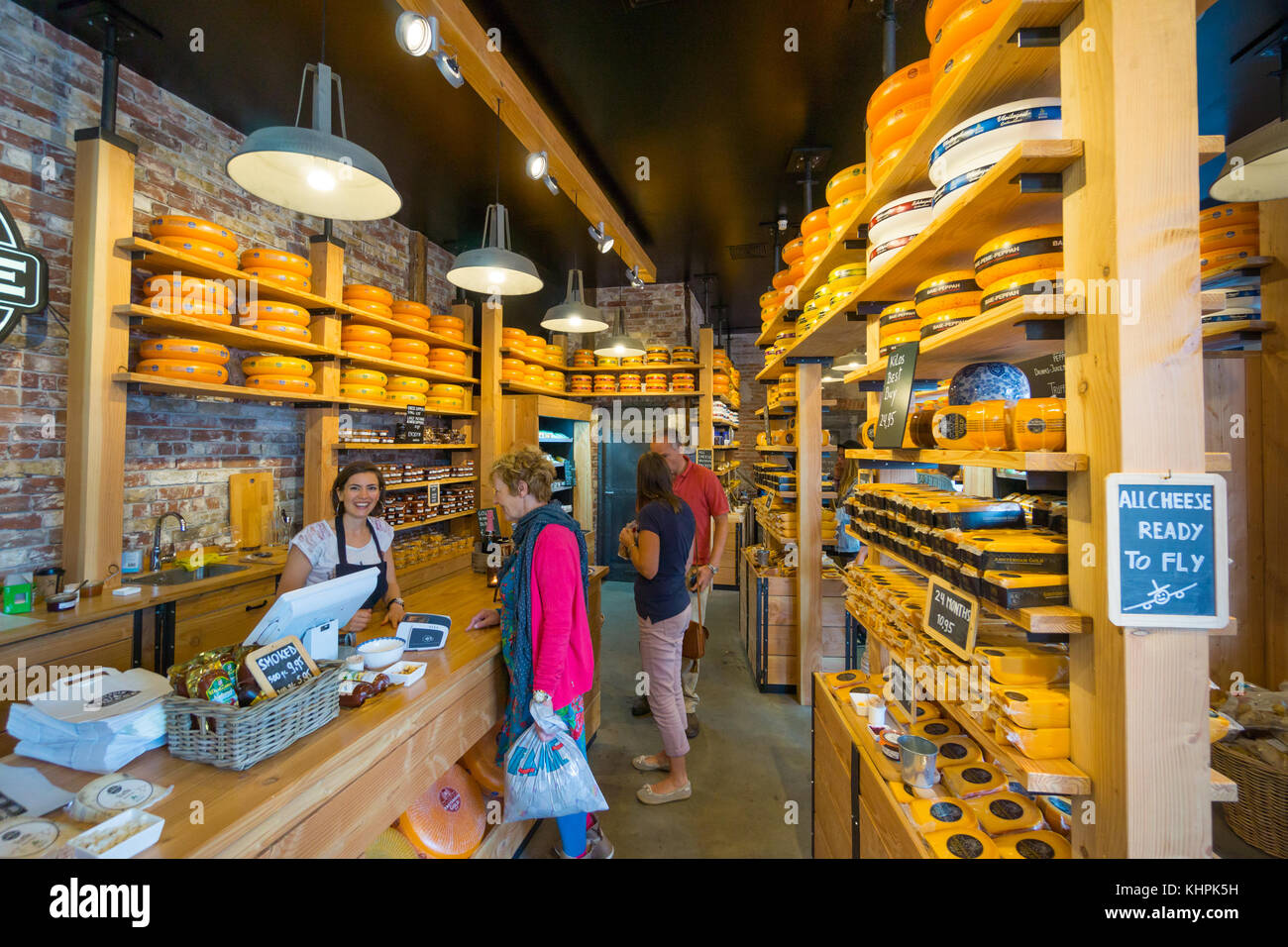 Cheese wheels are on the shelves in the store Stock Photo - Alamy