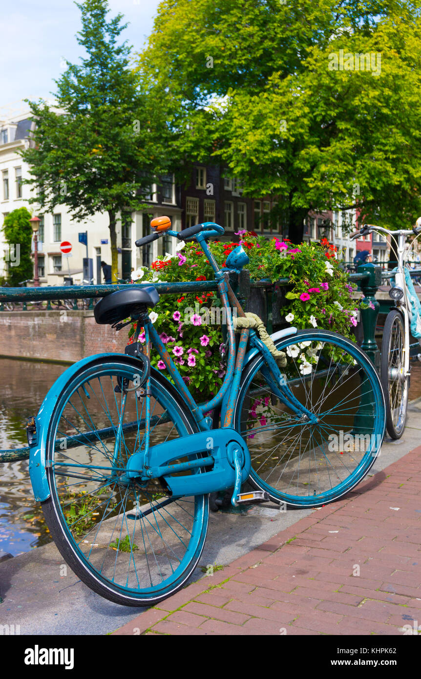 Traditional dutch bicycle parked on canal in Amsterdam Stock Photo - Alamy