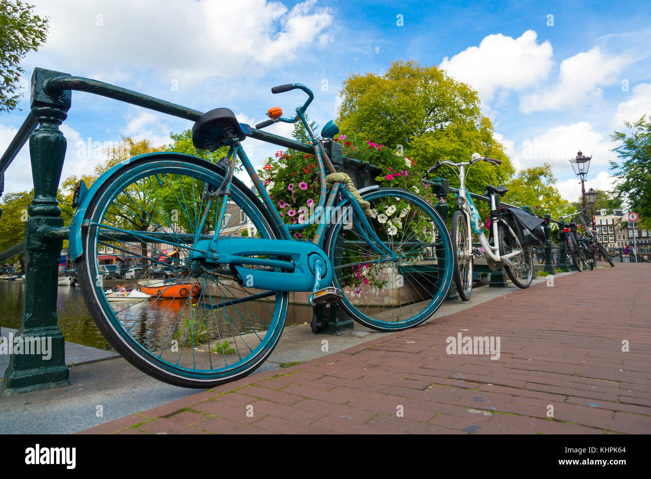 Traditional dutch bicycle parked on canal in Amsterdam Stock Photo - Alamy