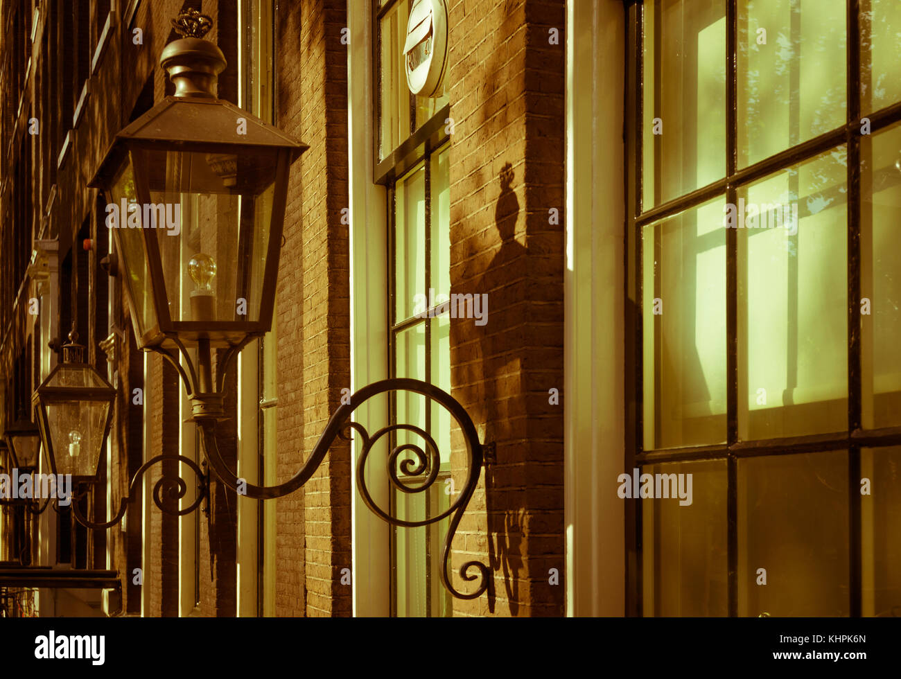Vintage lights on the buildings in the old city of Amsterdam. Retro ...