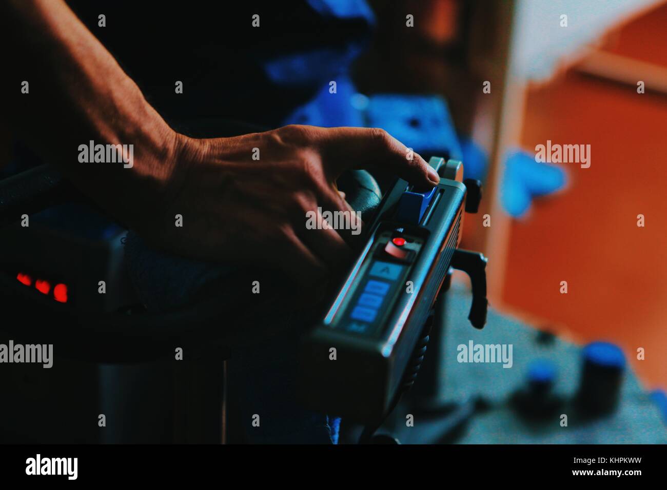 Male hand on remote controller of film camera or dolly. Videographer ...