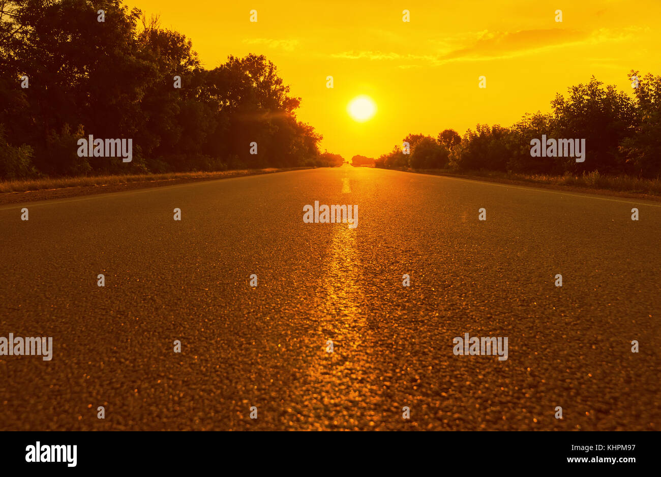 orange sunset and asphalt road. soft focus Stock Photo - Alamy