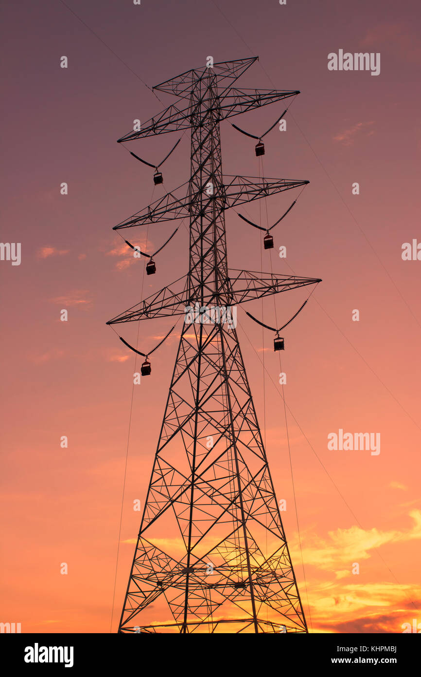 High-power pylon with sunset Stock Photo - Alamy