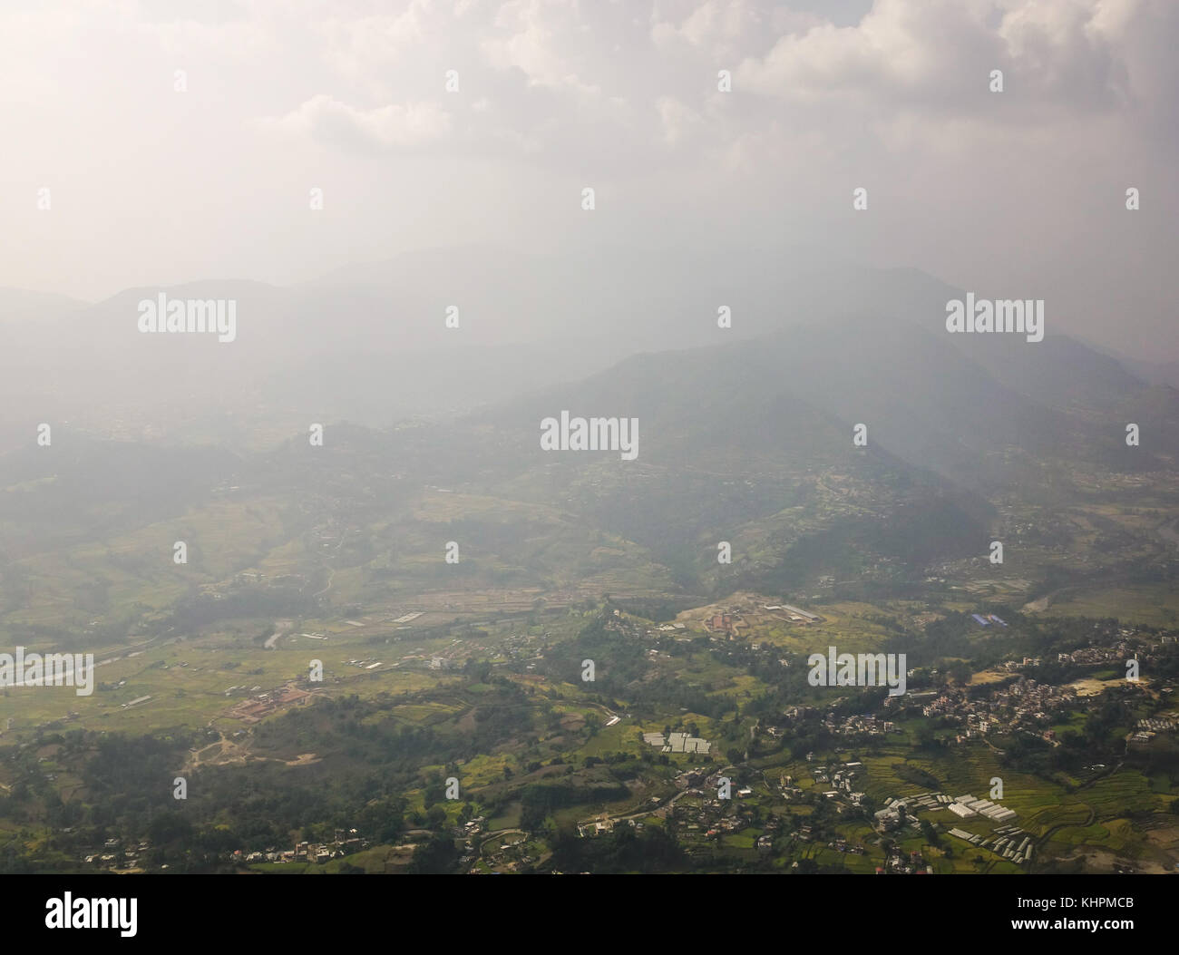 Aerial view of Nepal from wing of airplane. Nepal contains part of the ...