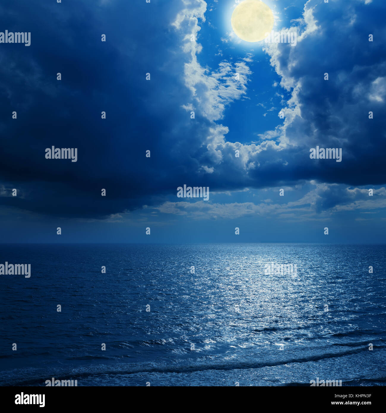 full moon in dramatic clouds and sea Stock Photo - Alamy