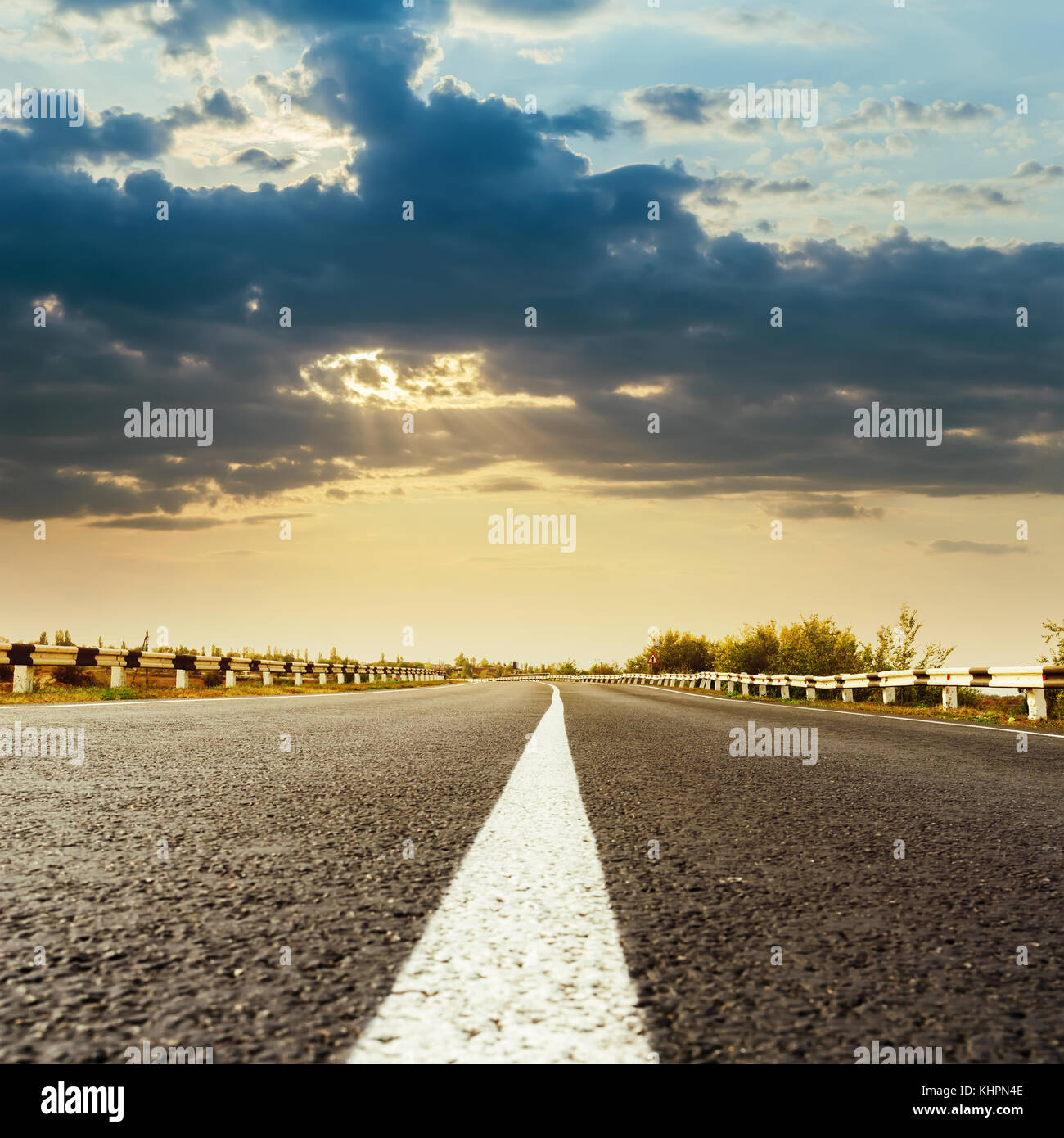 dramatic sky over asphalt road Stock Photo - Alamy