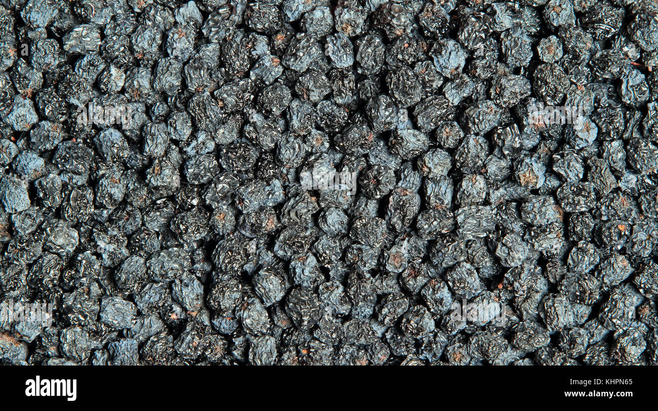 Texture of dried black aronia berries, food background Stock Photo - Alamy