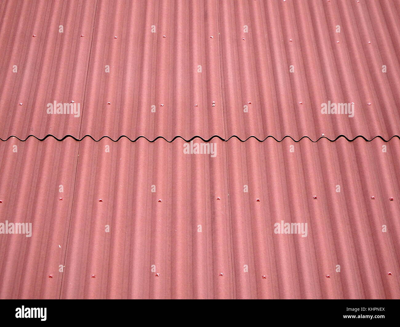 Red corrugated roof closeup background Stock Photo - Alamy
