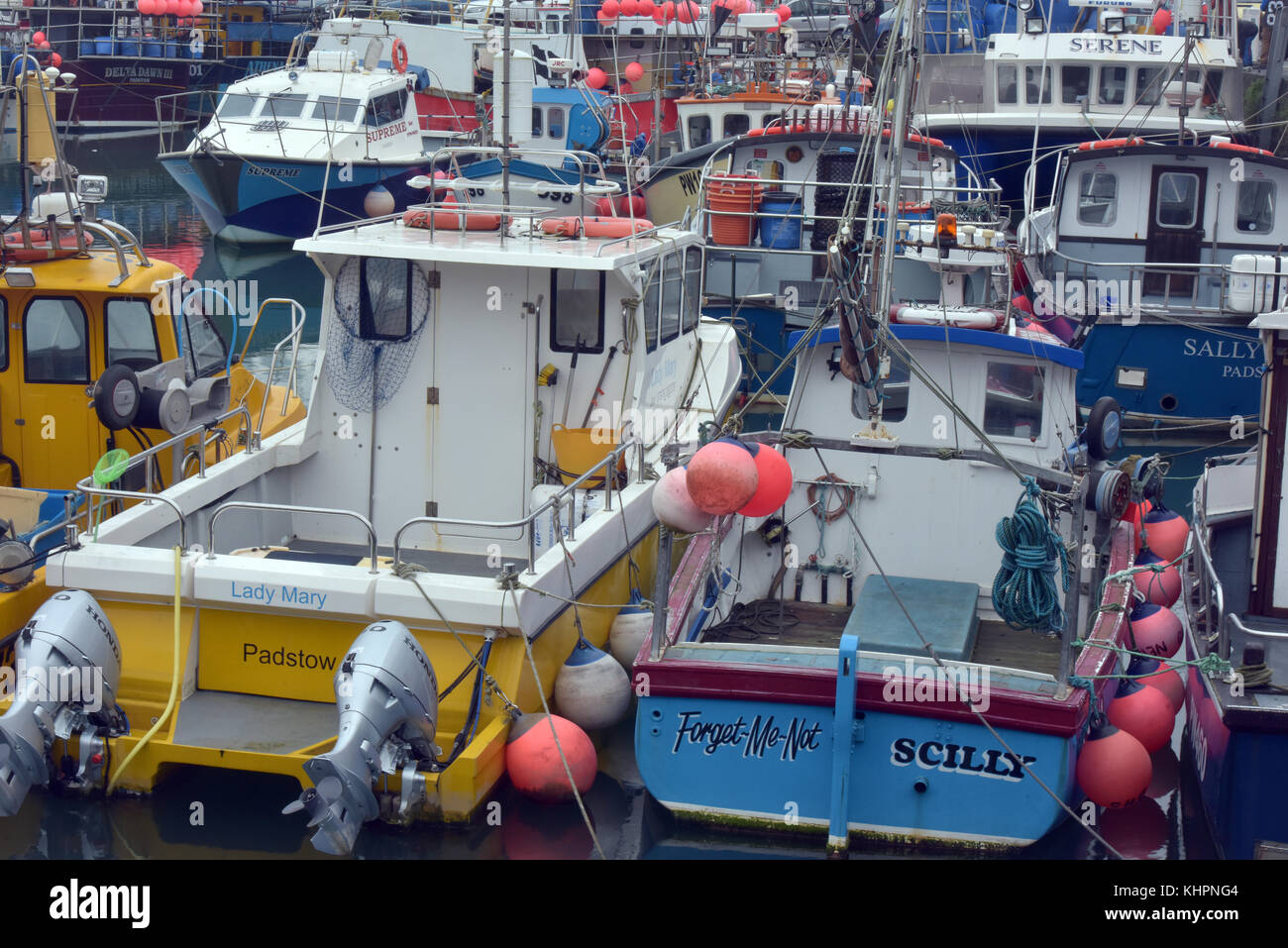 Lots of small. Trawlers and fishing boats crowded into Padstow harbour ...