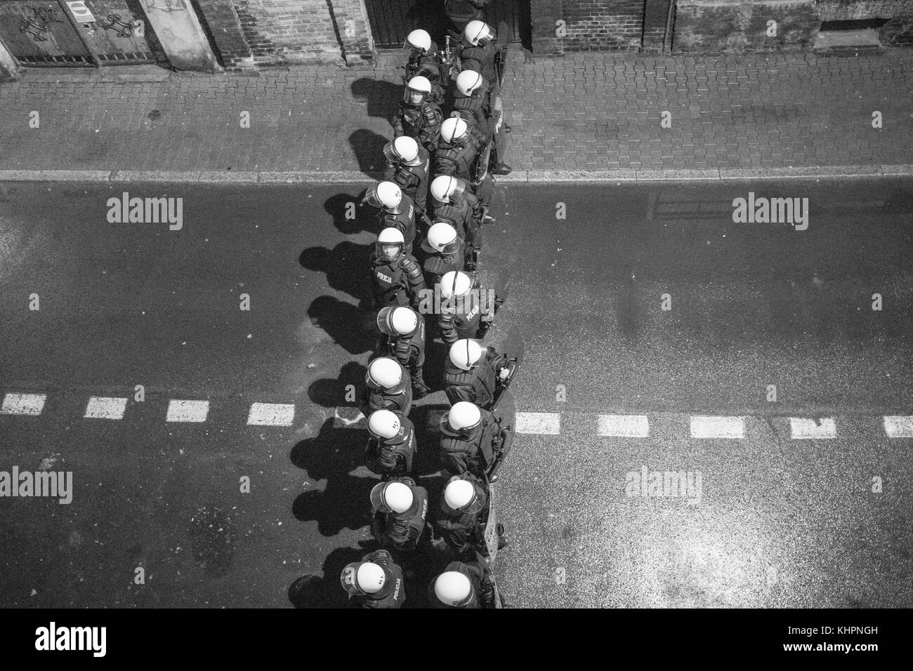 Polish riot police forces cordon on the street, night shot from above ...