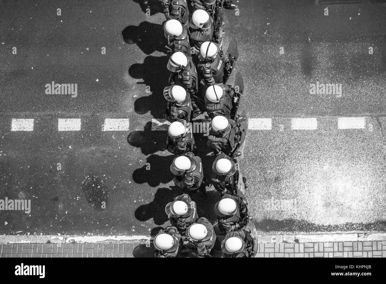 Polish riot police forces cordon on the street, night shot from above ...
