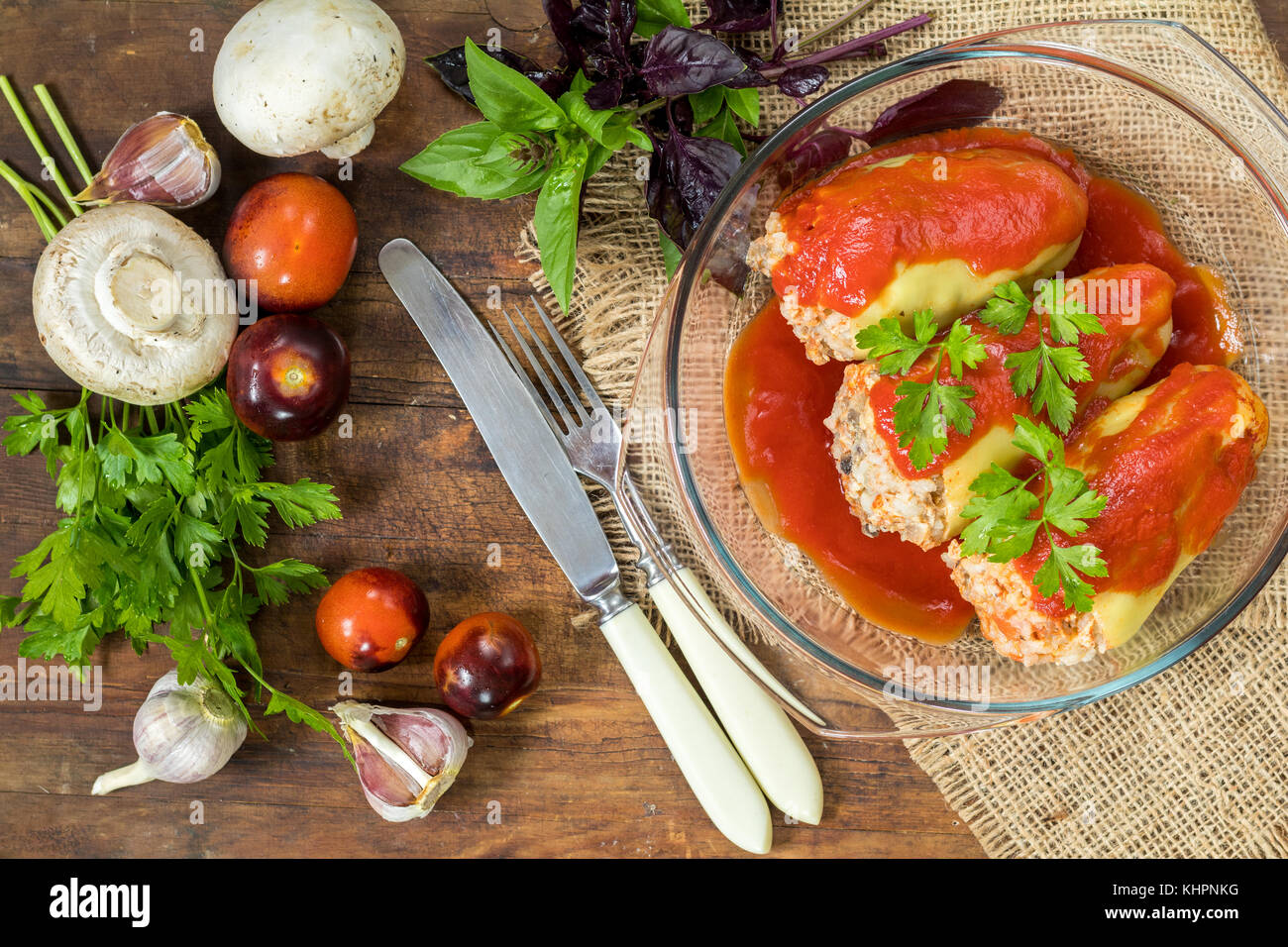 Yummy looking cooked stuffed pepper served in a transparent glass pot ...