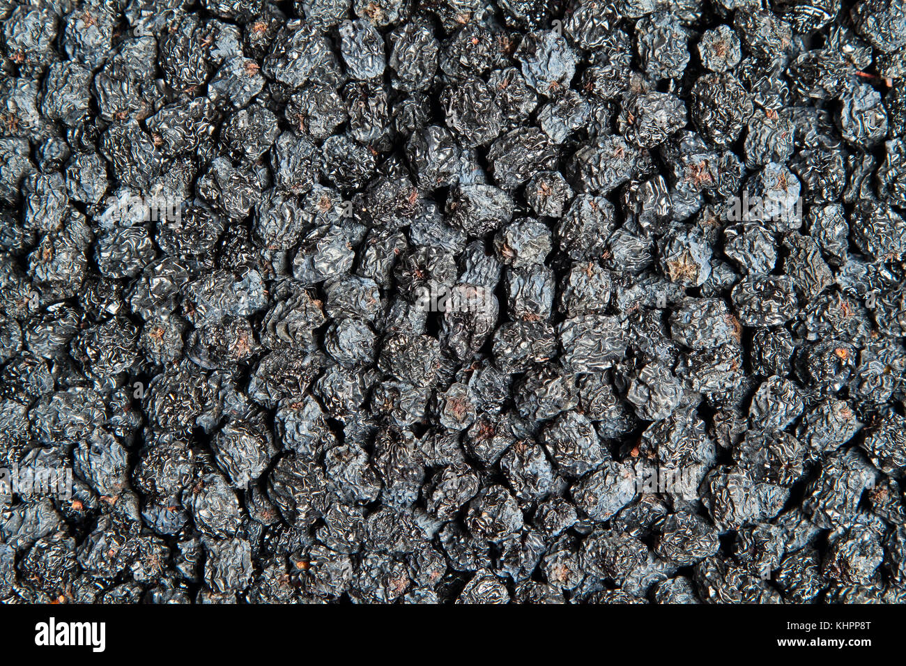 Texture of dried black aronia berries, food background Stock Photo - Alamy