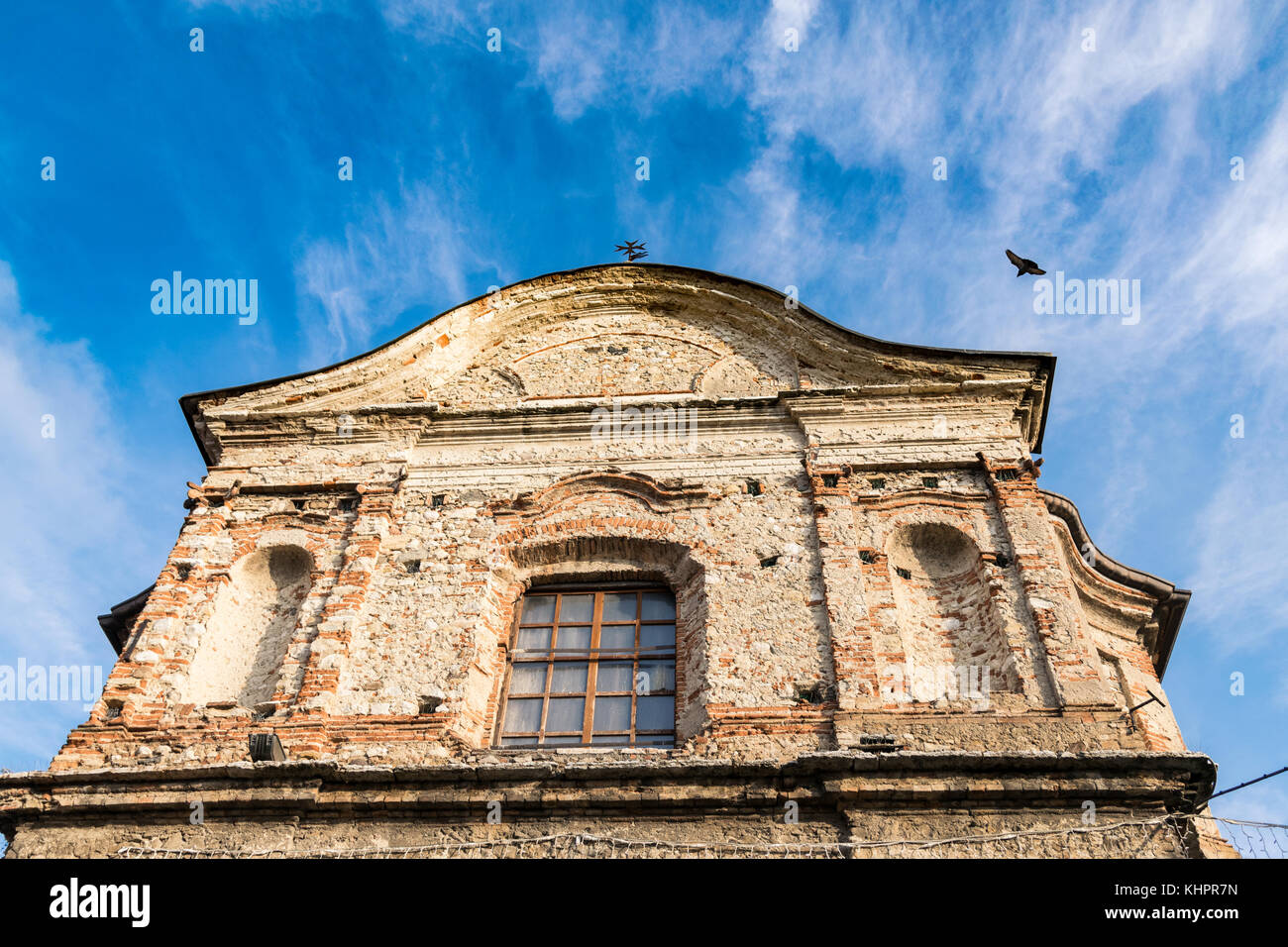 Detail of an ancient baroque Italian church built in stones and bricks ...