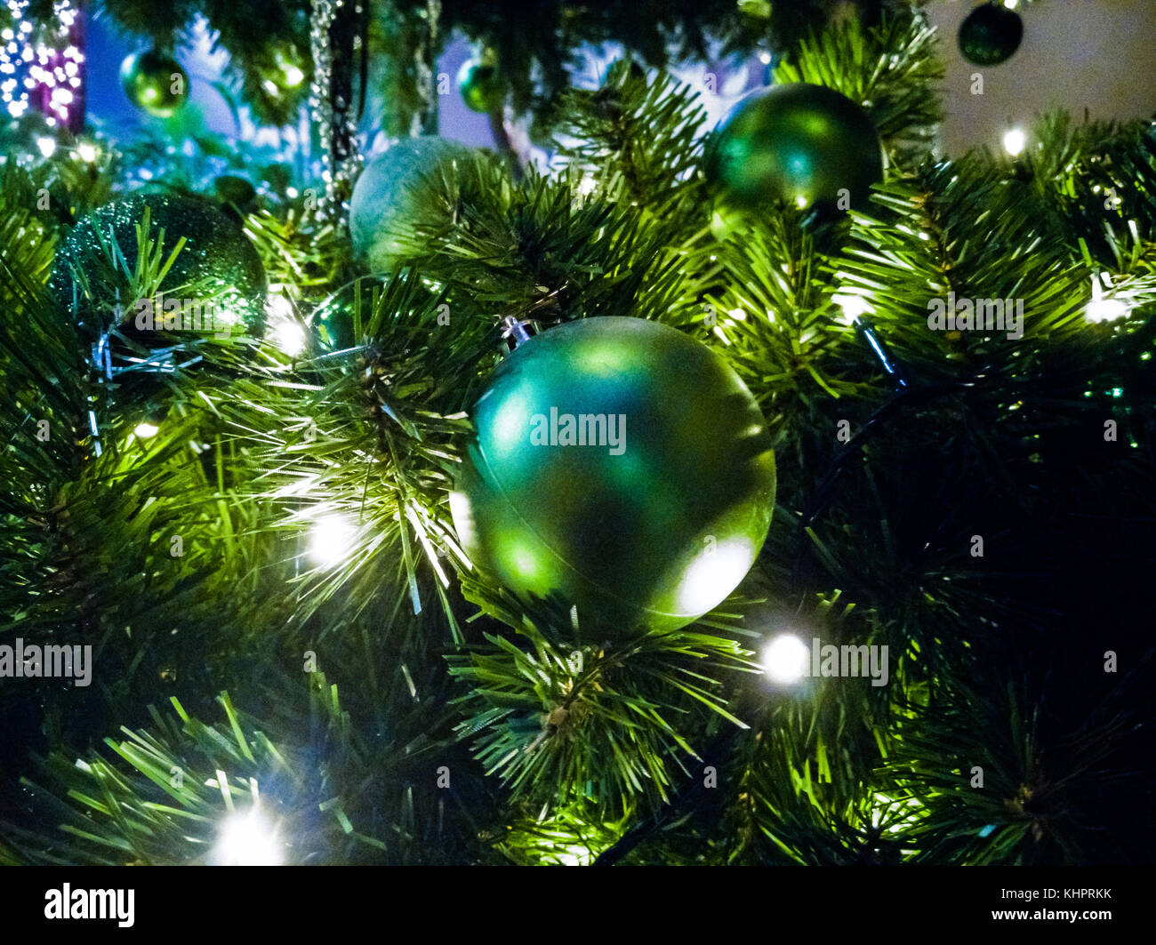 Traditional decorated Christmas tree in green colors with green balls ...