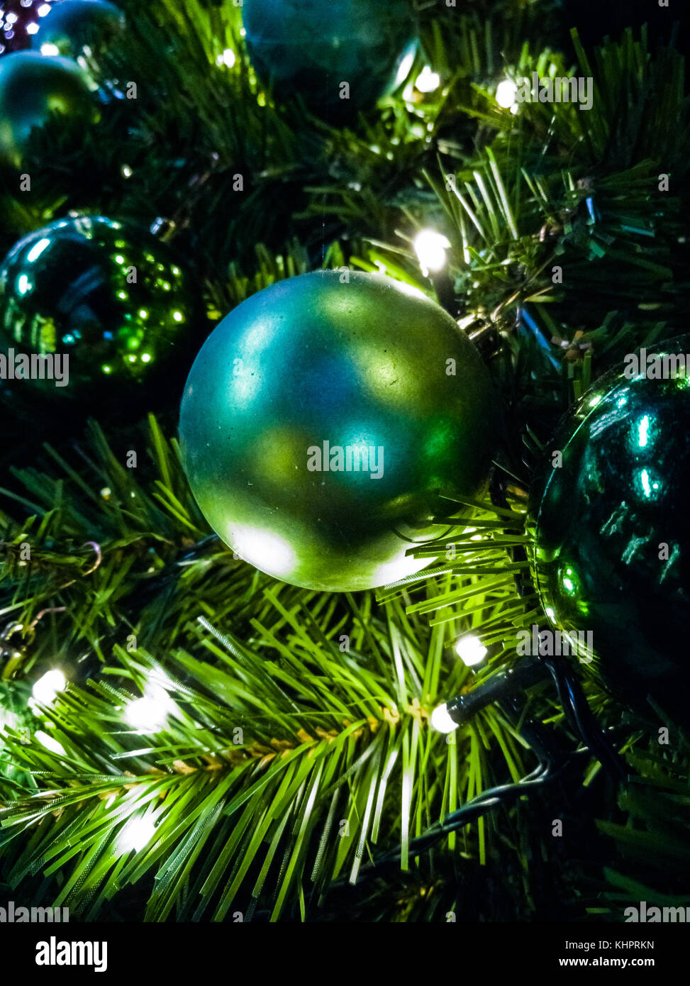 Traditional decorated Christmas tree in green colors with green balls ...