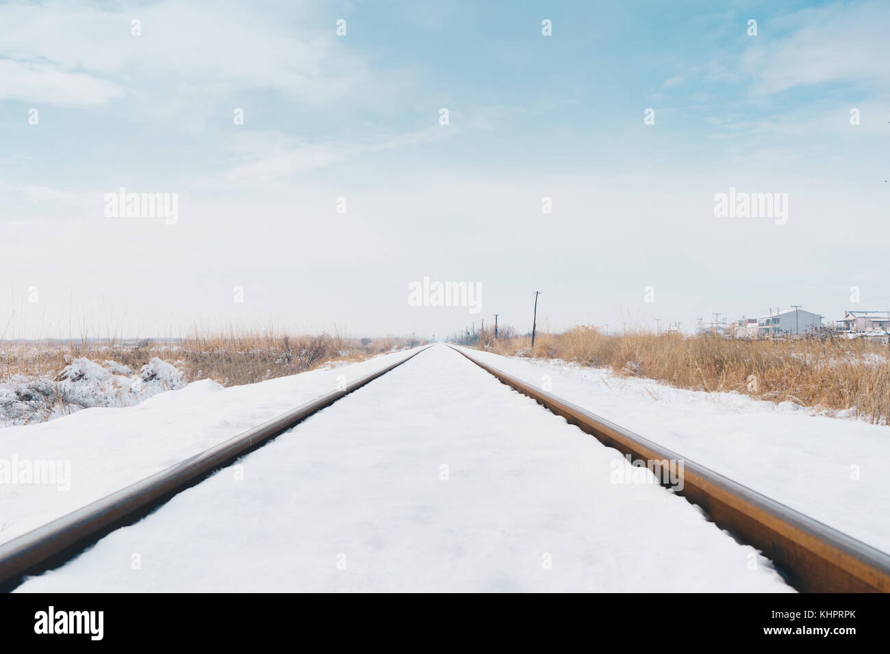 Railroad tracks covered in snow Stock Photo - Alamy