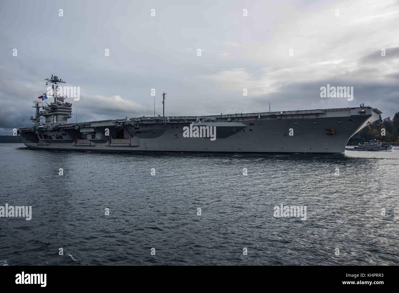 The Nimitz-class aircraft carrier USS John C. Stennis (CVN 74) transits Puget Sound as it ...