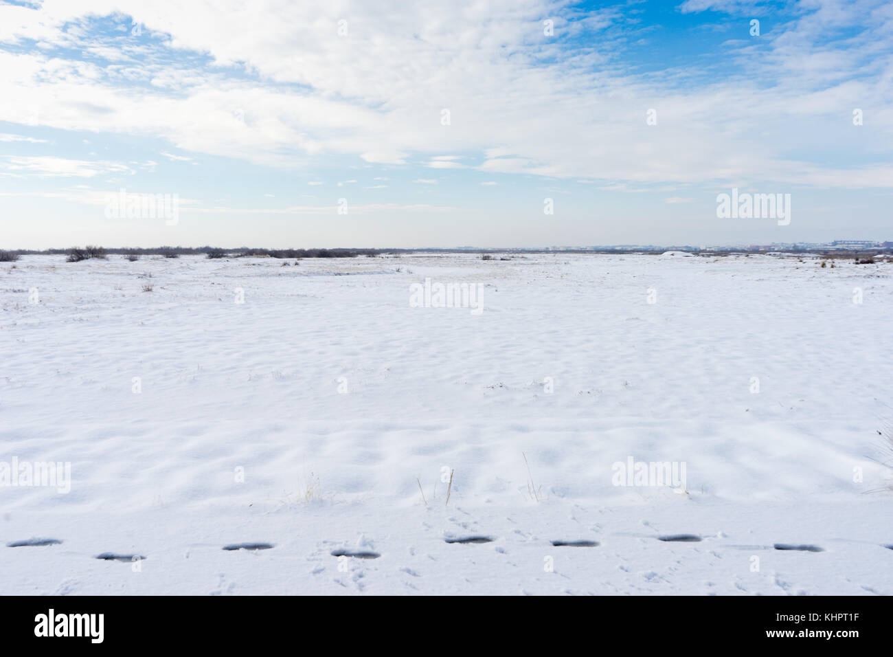 Footprints on fresh snow and snowy landscape Stock Photo - Alamy