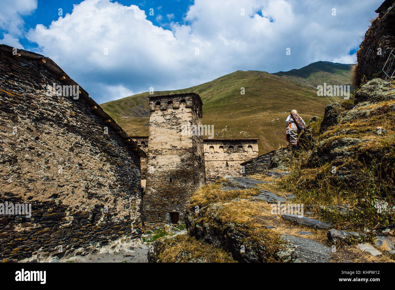 Village Ushguli landscape with massive rocky mountains Bezengi wall ...