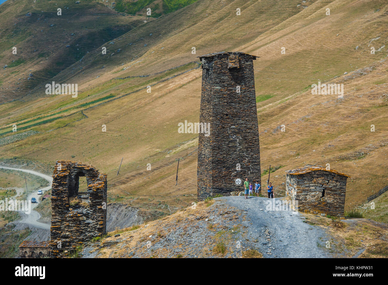 Village Ushguli landscape with massive rocky mountains Bezengi wall ...