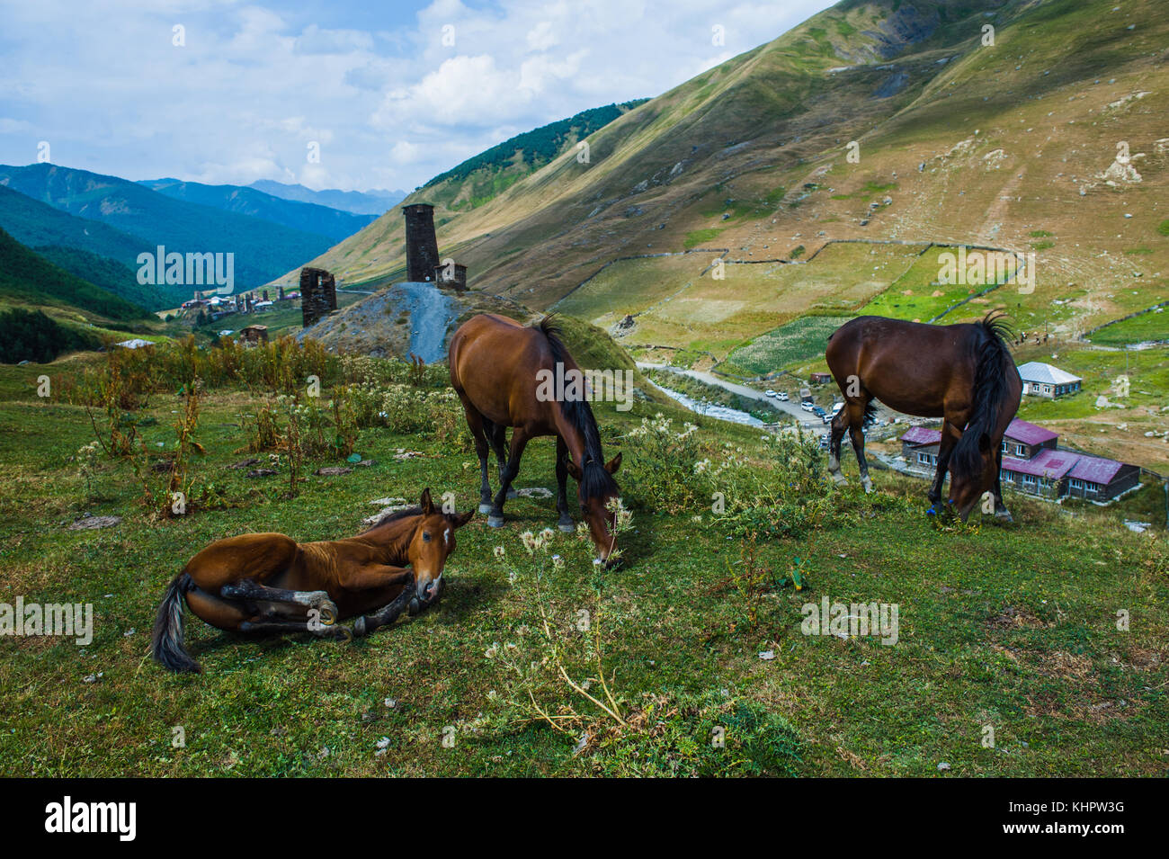 Village Ushguli landscape with massive rocky mountains Bezengi wall ...