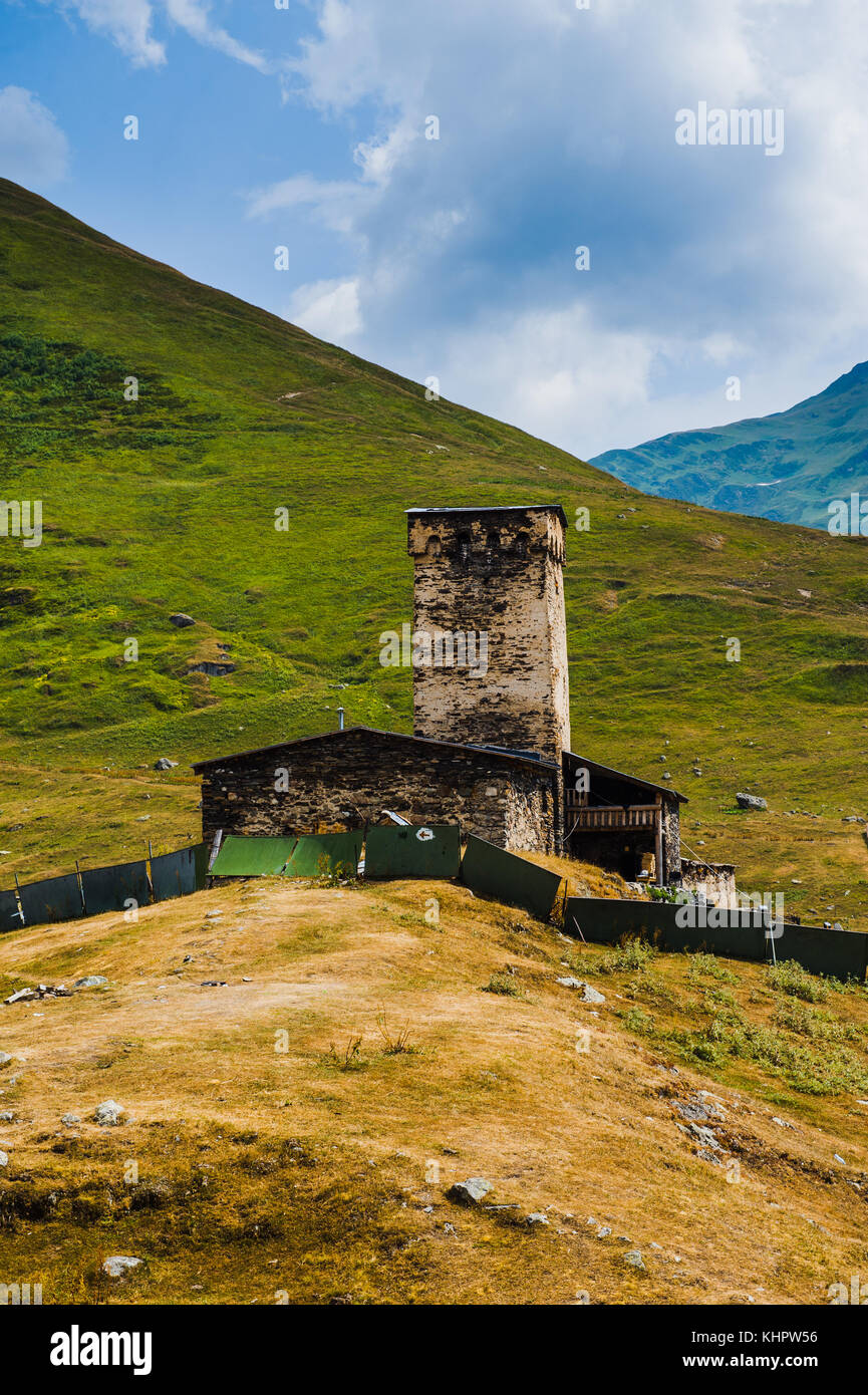 Village Ushguli landscape with massive rocky mountains Bezengi wall ...
